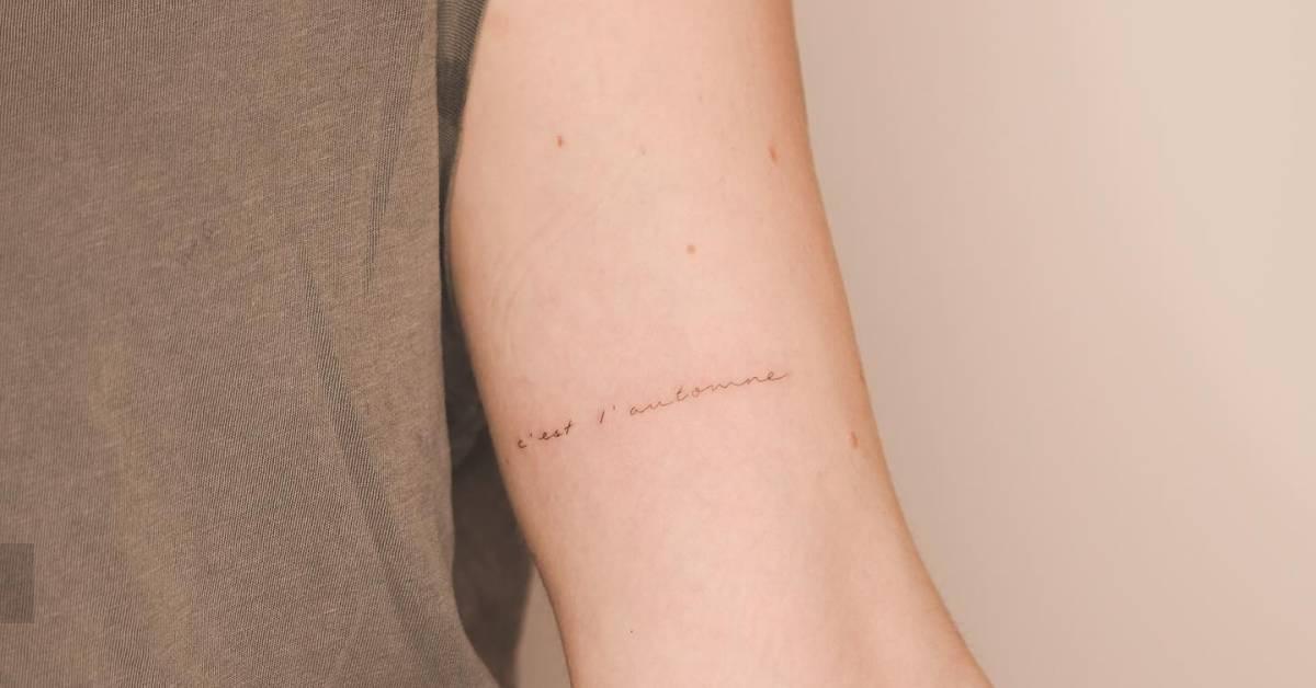 "C'est l'automne" lettering tattoo handwritten on the