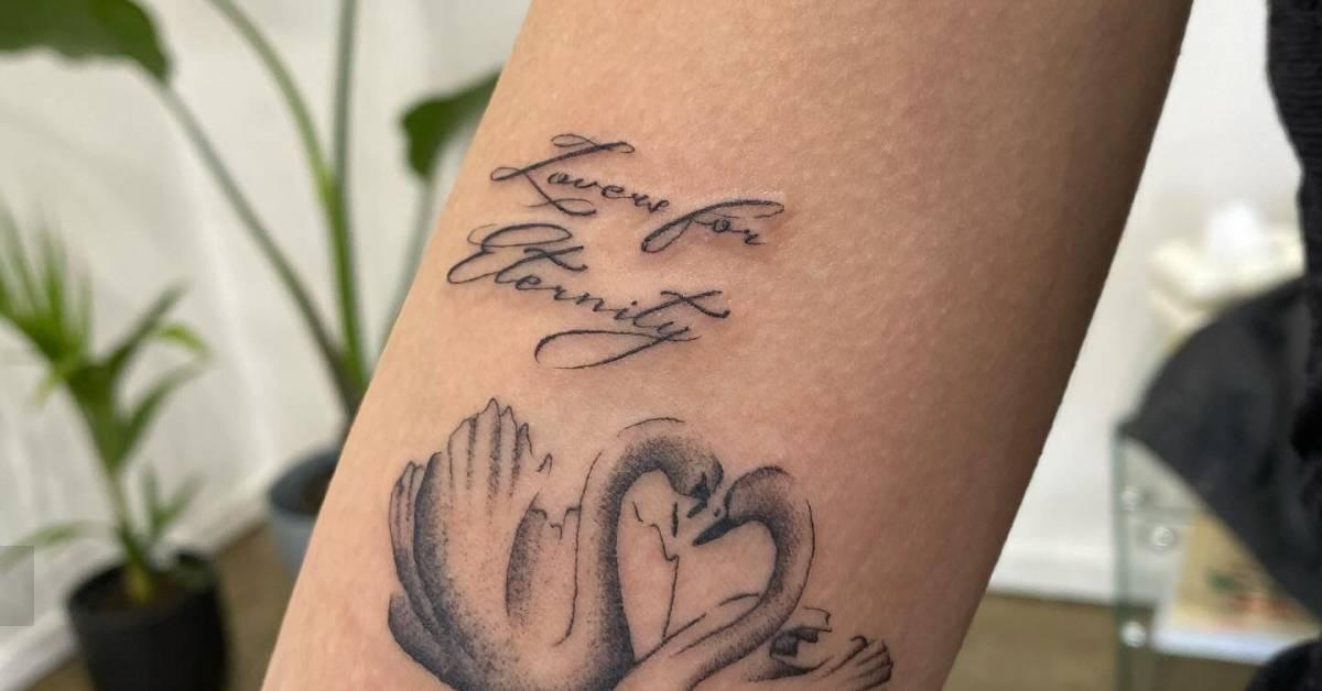 "Lovers for eternity" and swan couple tattooed on the