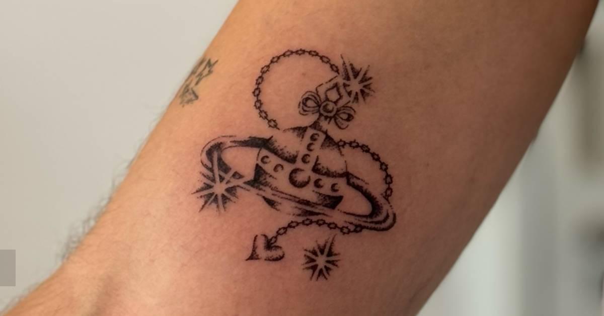 Illustrative style Vivienne Westwood orb tattoo done on