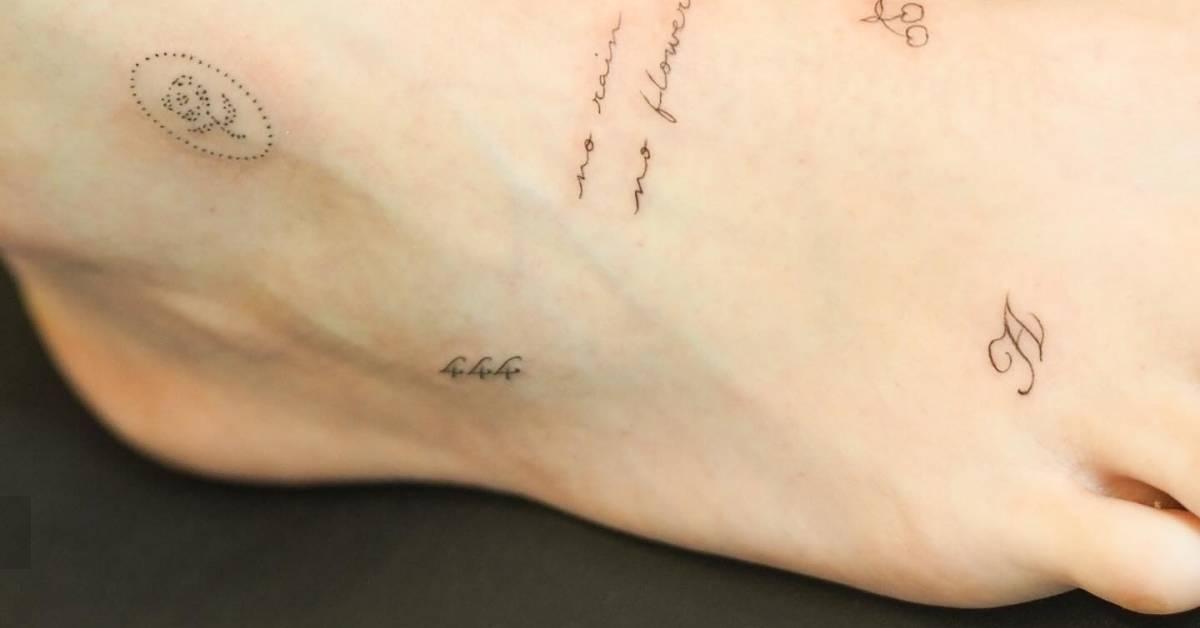 Fine line style foot composition tattoos.