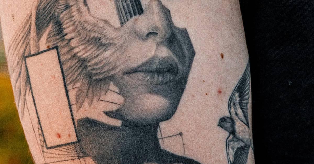 Graphic style upper arm composition tattoo (healed).
