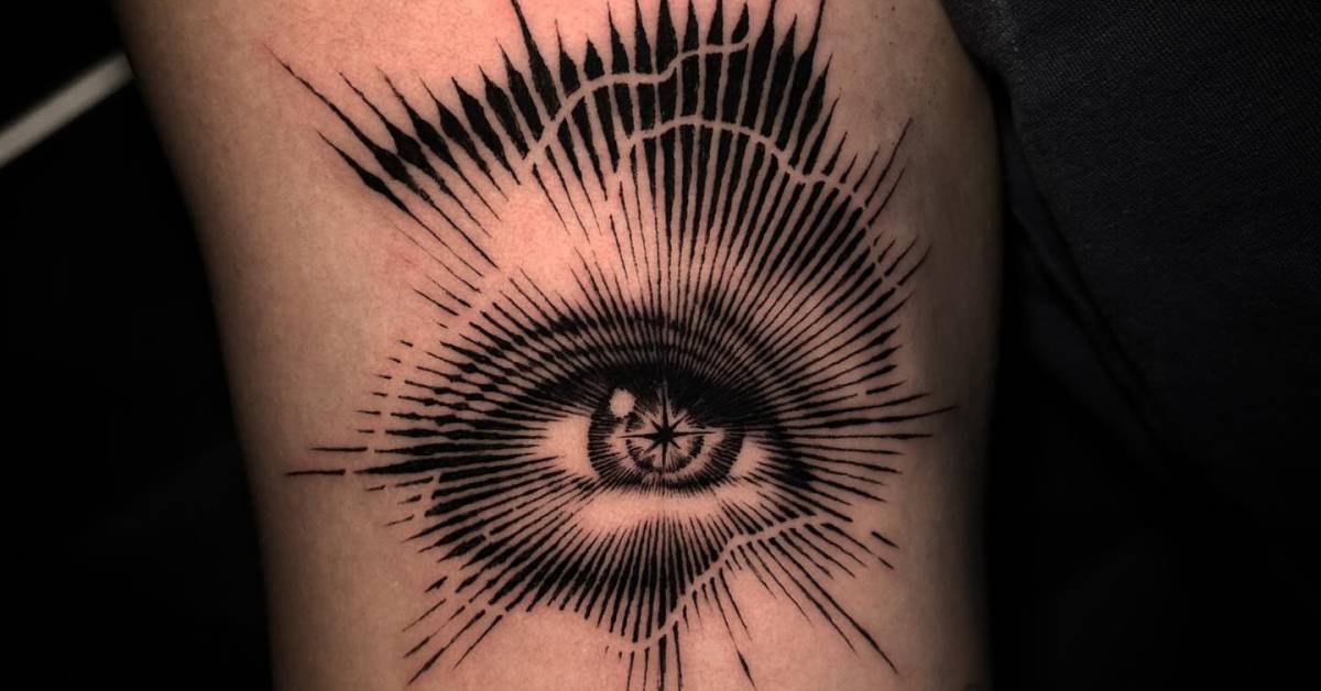 Blackwork style eye tattoo located on the bicep.