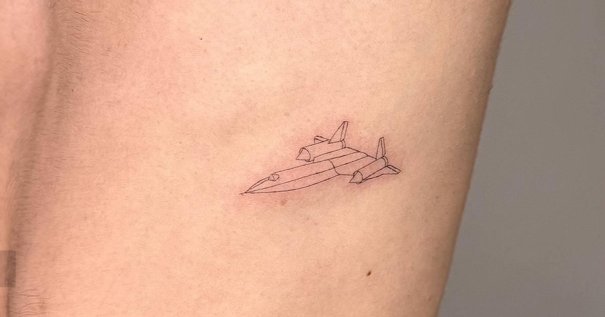 Fine line style jet fighter tattoo done on the rib.