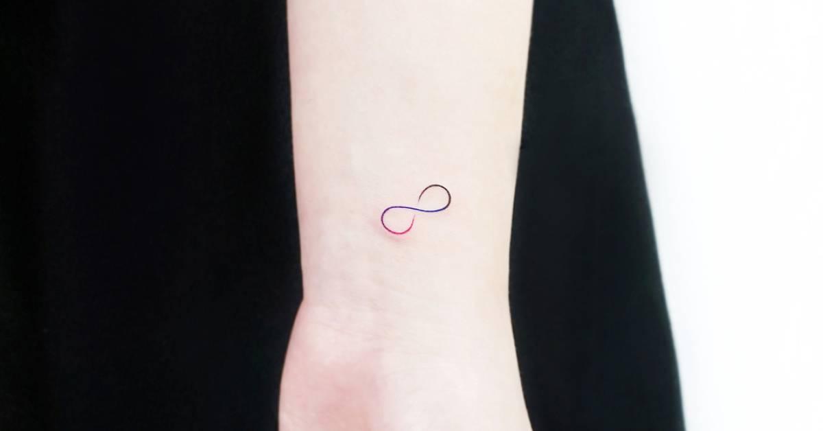 Minimalistic spectrum infinity symbol tattoo placed on