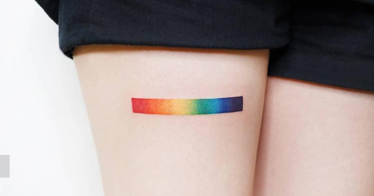 Visible spectrum tattoo located on the thigh.