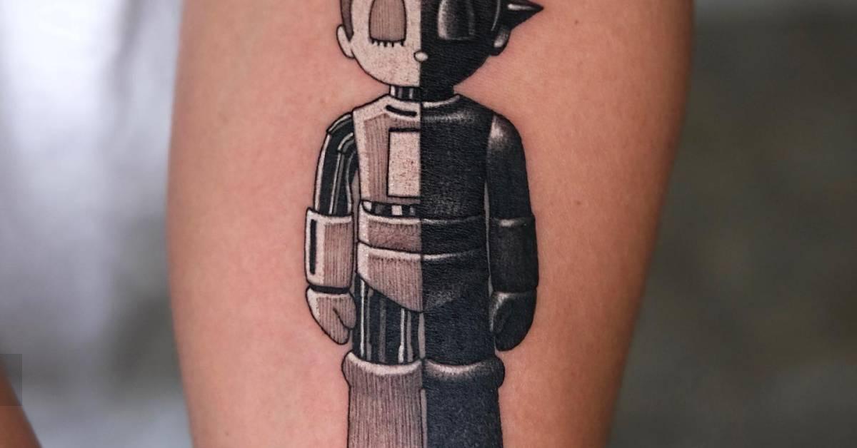 Astro Boy tattoo located on the inner forearm, cartoon