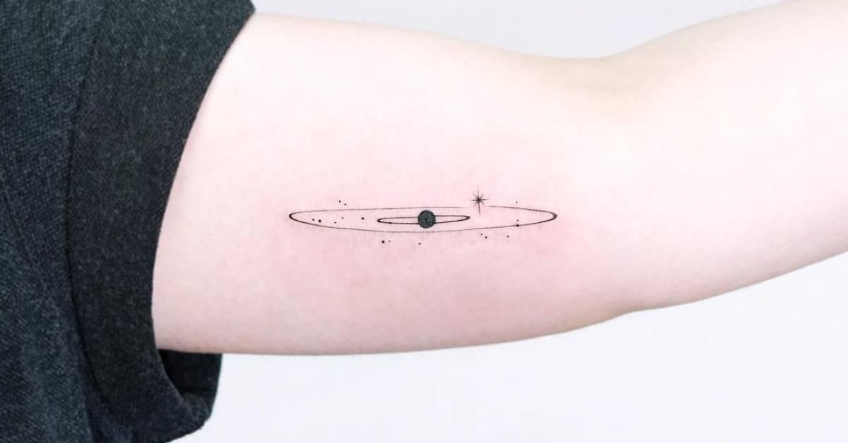 Minimalistic style Andromeda galaxy tattoo located on