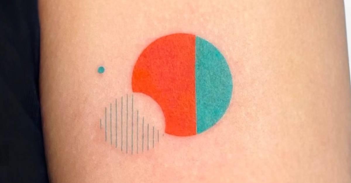 Abstract circles tattoo located on the upper arm.