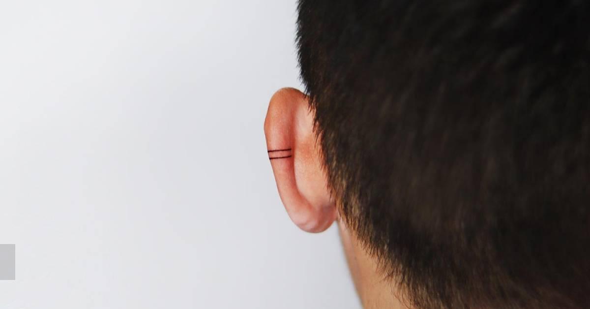 Little lines tattooed on the ear helix, minimalistic
