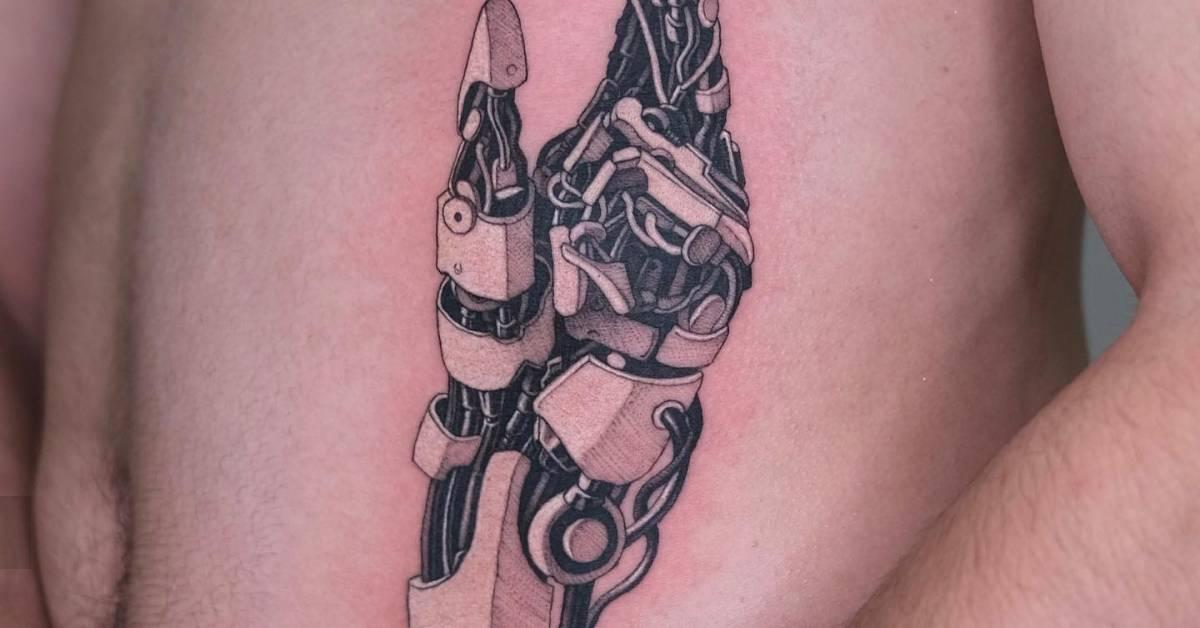 Robotic hand tattoo located on the rib, comic style.