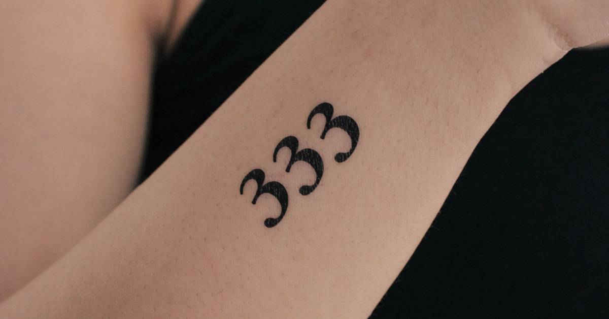 "333" angel number temporary tattoo located on the