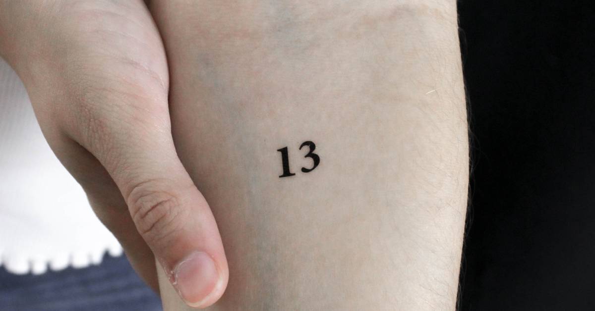 Number "13" temporary tattoo located on the inner
