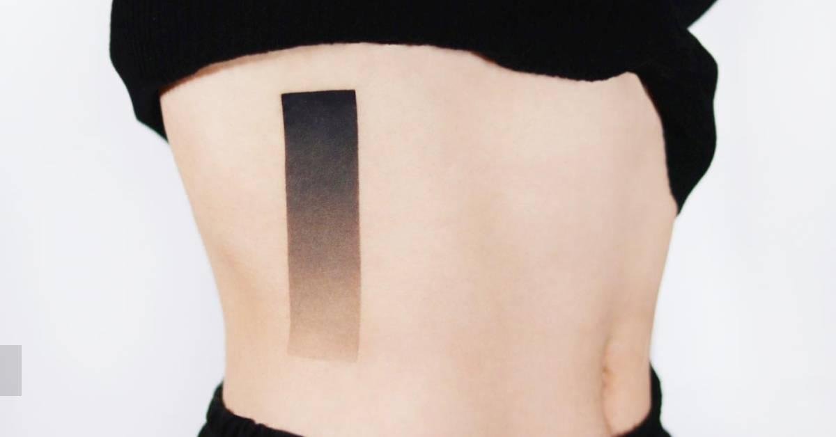 Spectrum rectangle tattoo located on the rib.