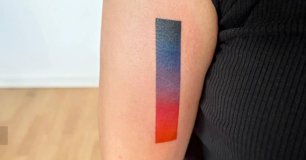 Spectrum rectangle tattoo located on the upper arm.