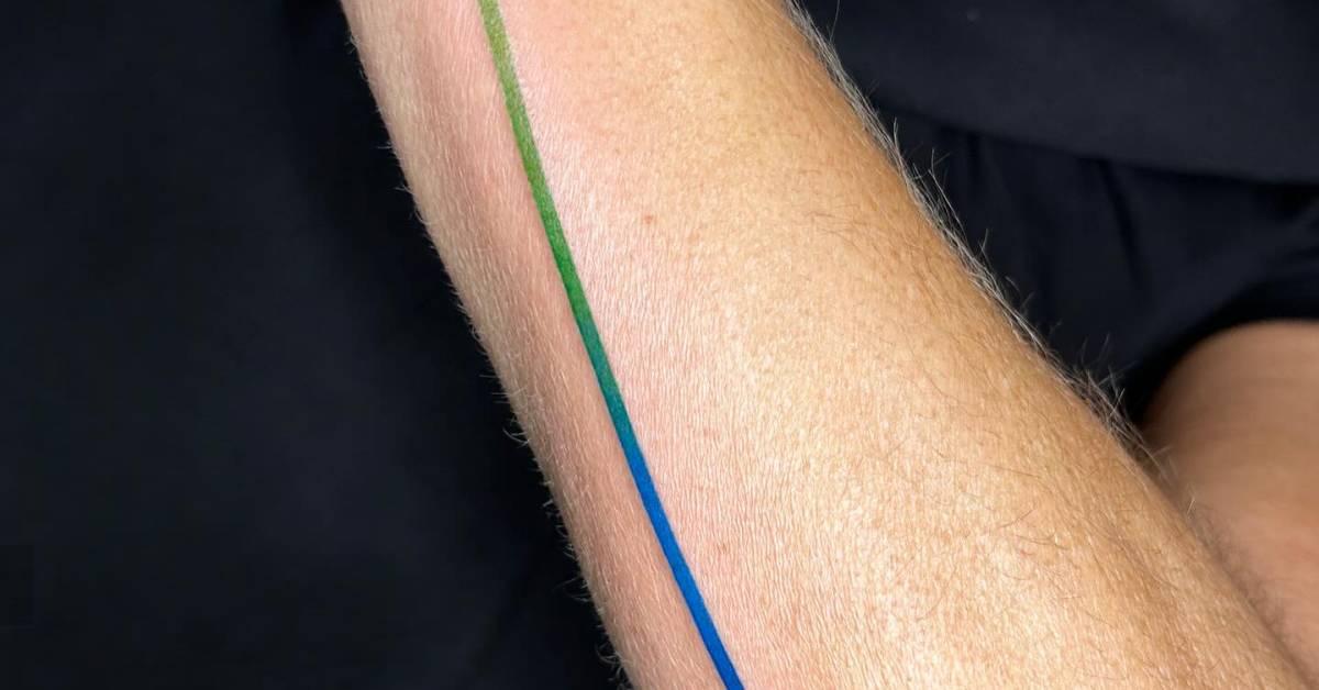 Geometric style spectrum line tattoo located on the