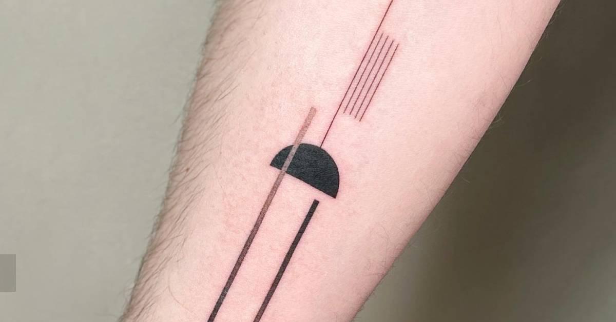 Abstract geometric tattoo done on the inner forearm.