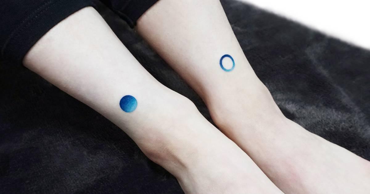 Individual matching gradient circles tattooed on the