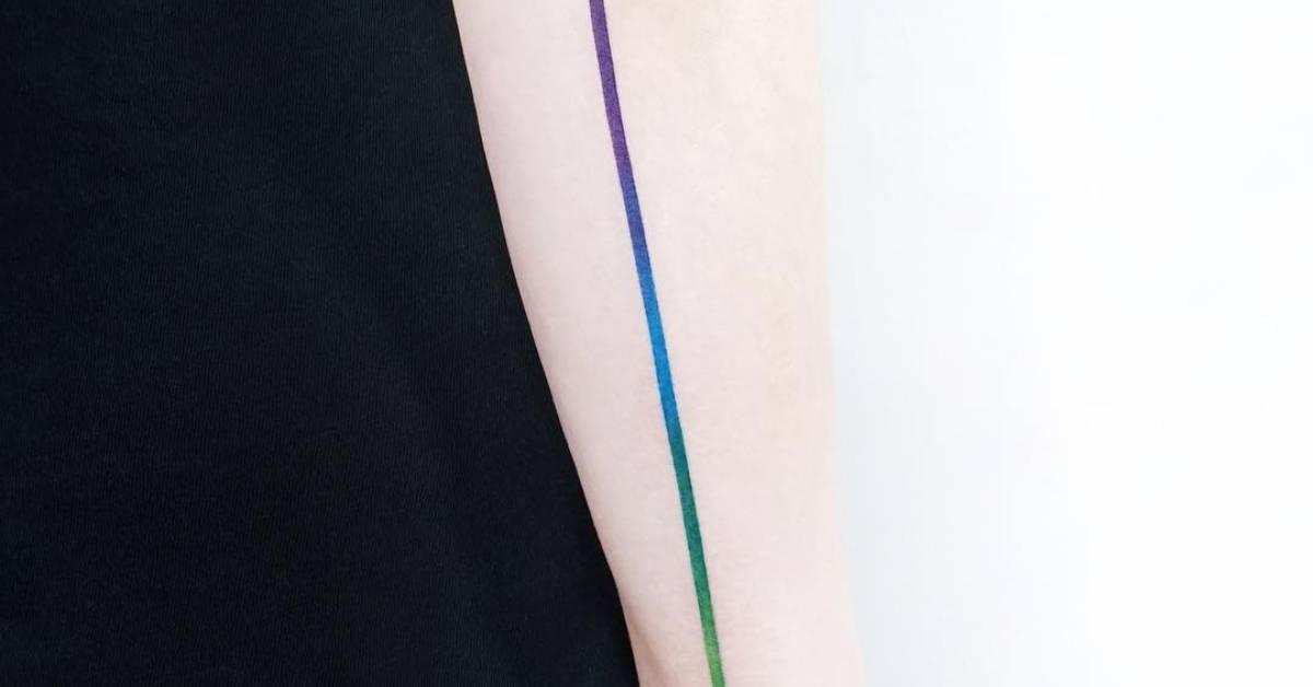 Spectrum line tattooed on the forearm, watercolor