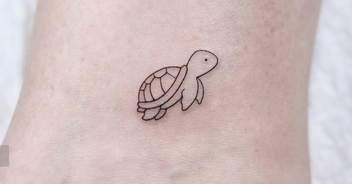 Minimalistic turtle tattoo located on the ankle.