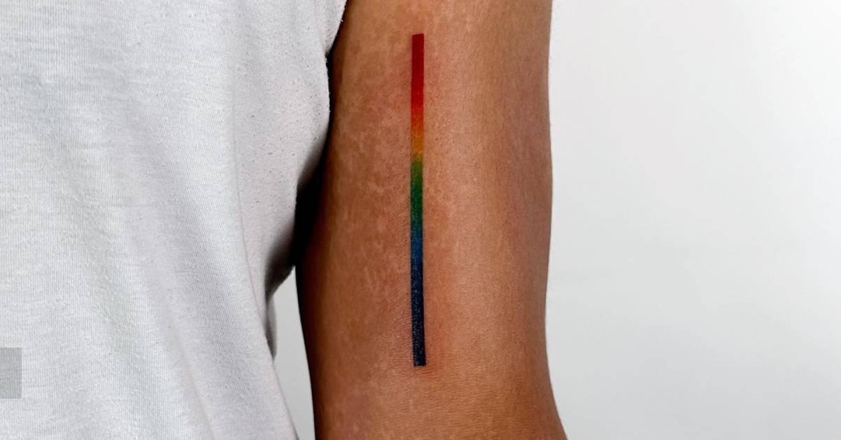 Visible spectrum tattoo located on the bicep.