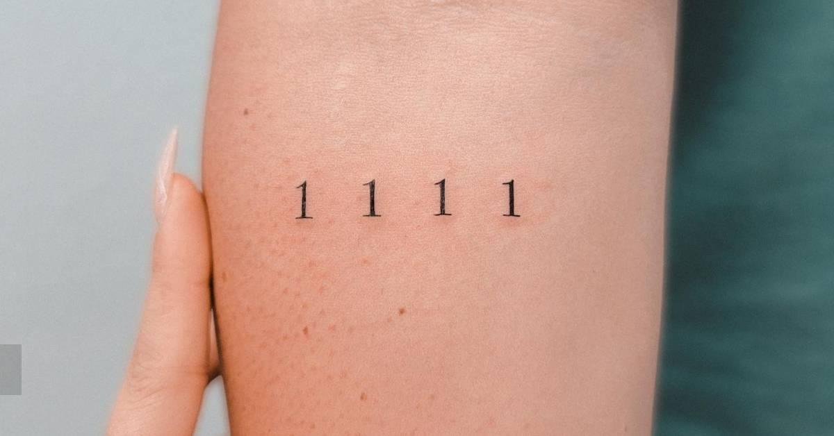 "1111" lettering tattoo located on the inner forearm.