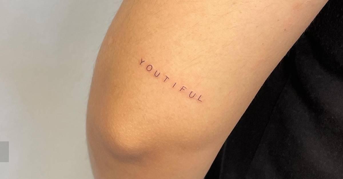Tattoo of the word "youtiful' located on the tricep.