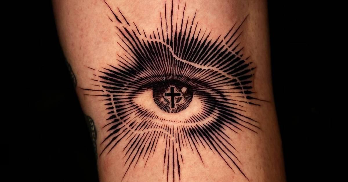 Blackwork style eye tattoo placed on the upper arm.