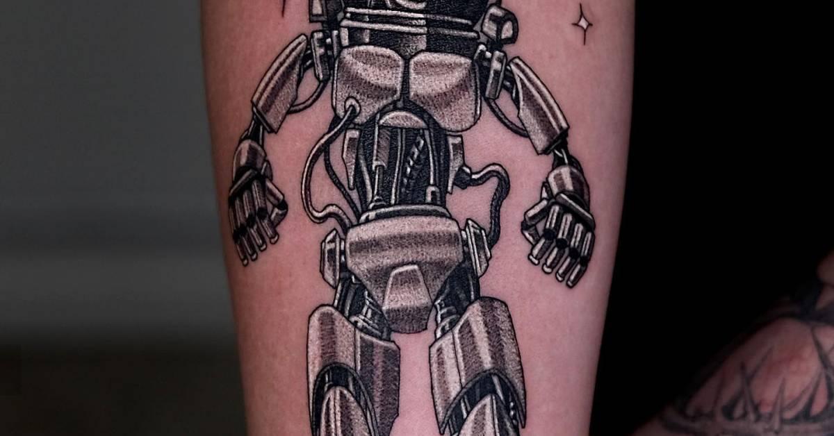 Comic style humanoid robot tattoo located on the inner