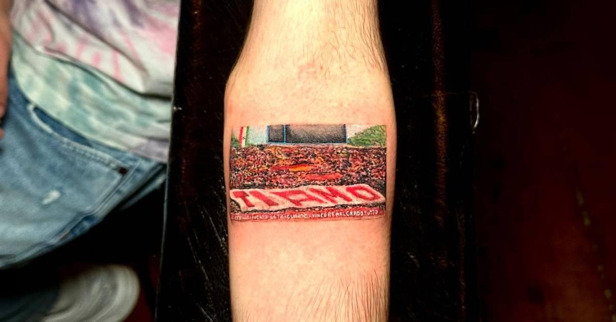 A.S. Roma tattoo located on the inner forearm.