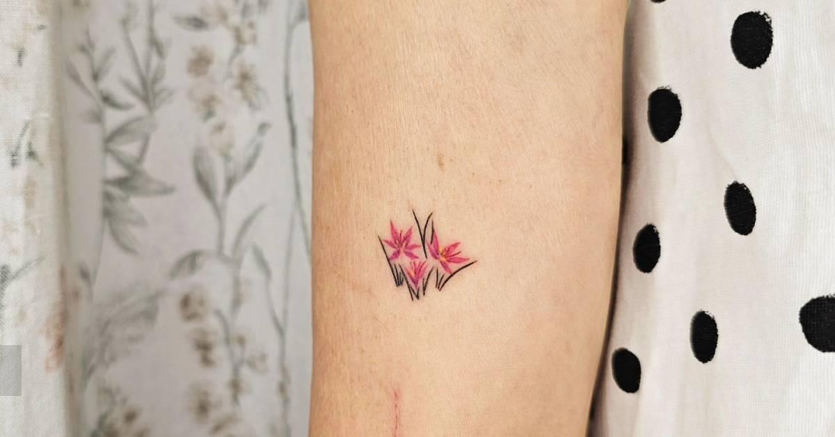 Saffron flowers tattooed on the upper arm, watercolor