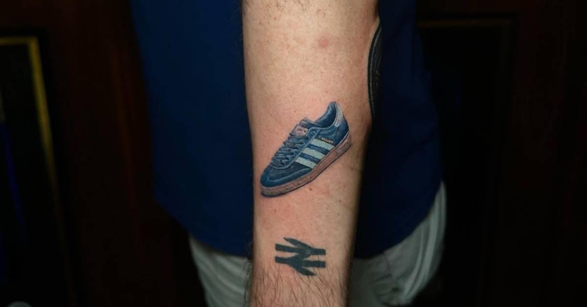 Adidas Samba tattoo located on the forearm,