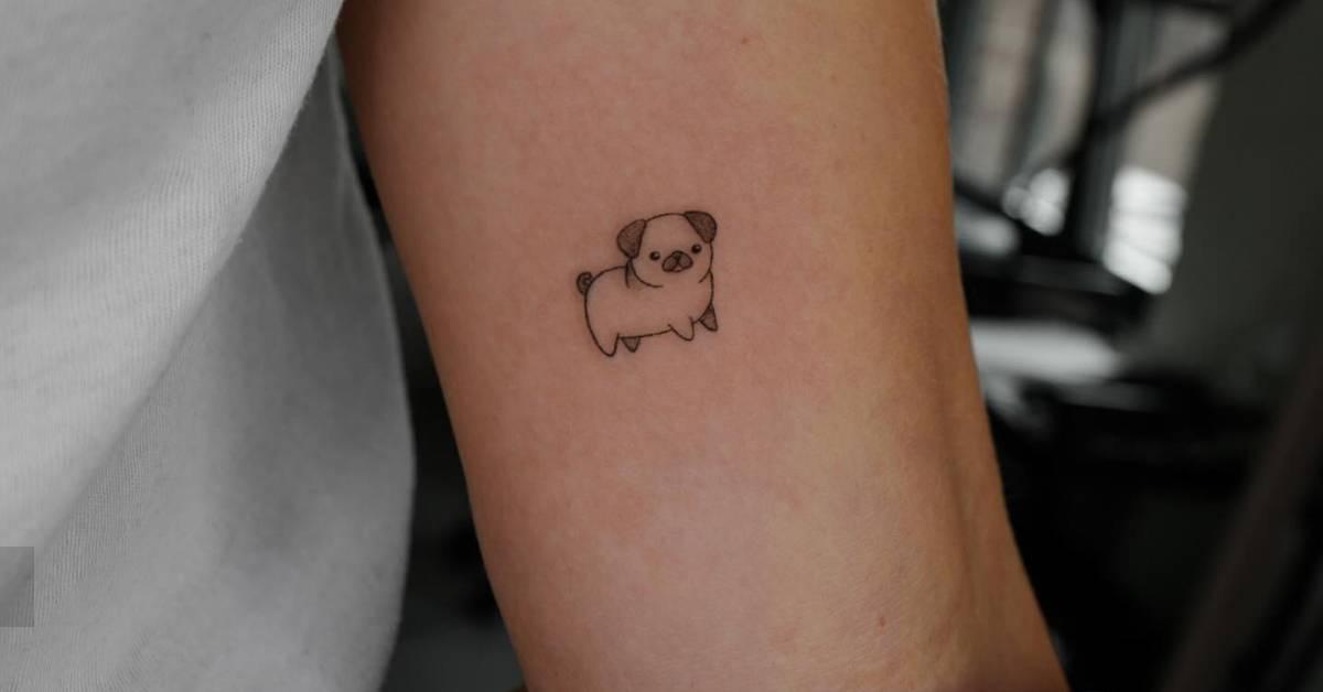 Minimalistic style pug tattoo done on the inner arm.