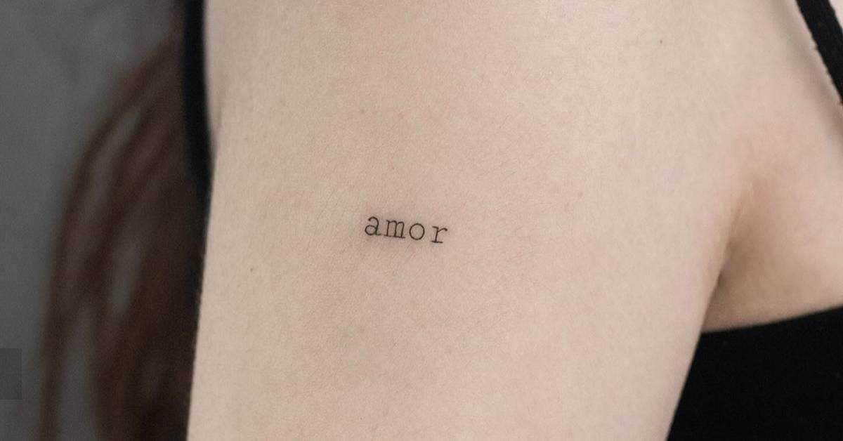Tattoo of the word "amor" in typewriter font placed on