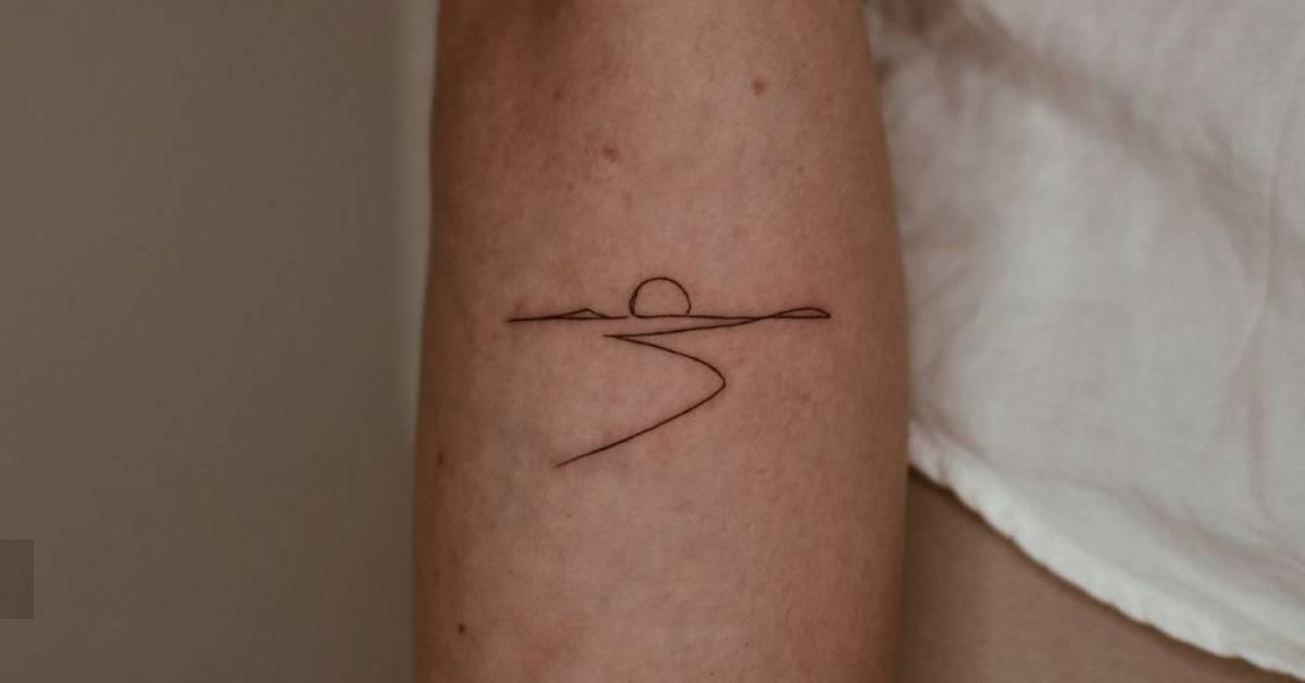 Continuous line sea sunset tattoo located on the