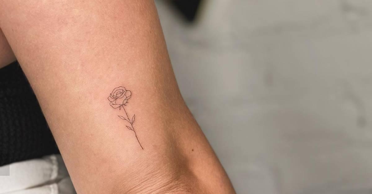 Fine line rose tattoo done on the tricep.