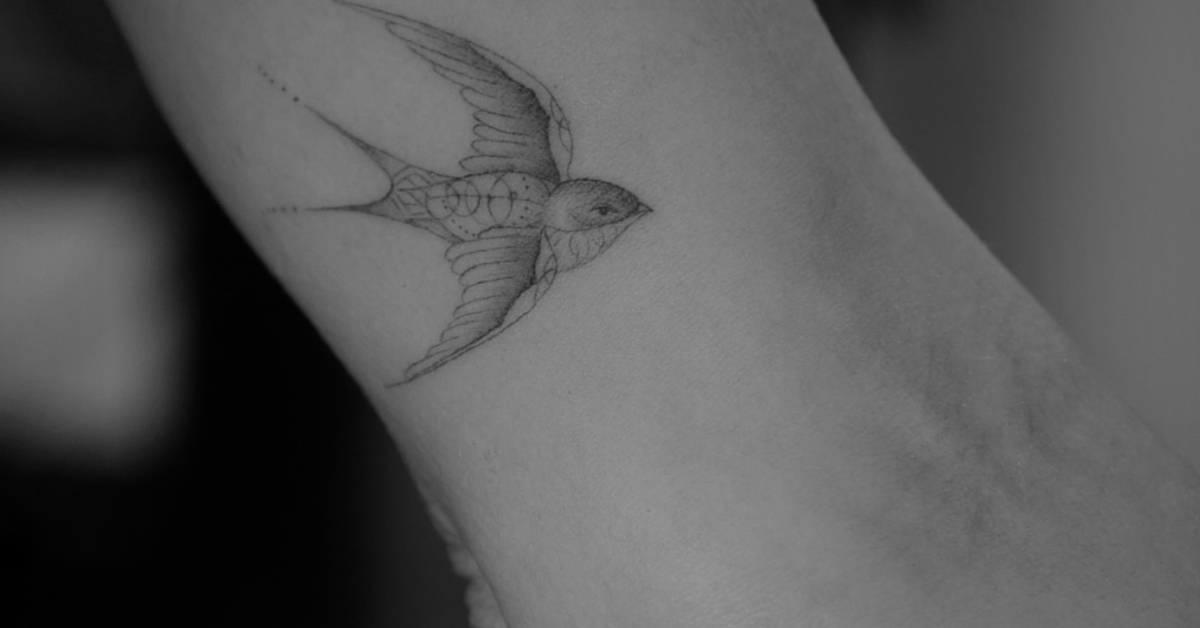 Single needle swallow tattoo located on the inner arm.