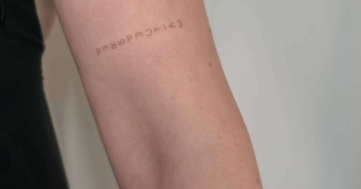 Lettering tattoo of the word "perspective" located on