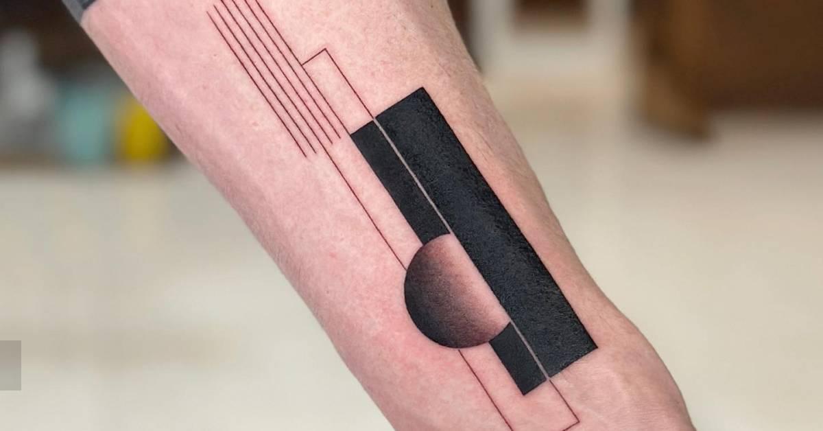 Abstract geometric tattoo located on the wrist.