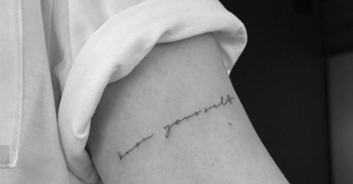 "Know yourself" lettering tattoo handwritten on the