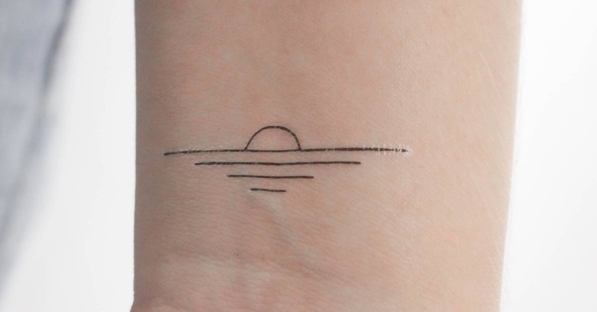 Minimalistic style sea sunset temporary tattoo done on