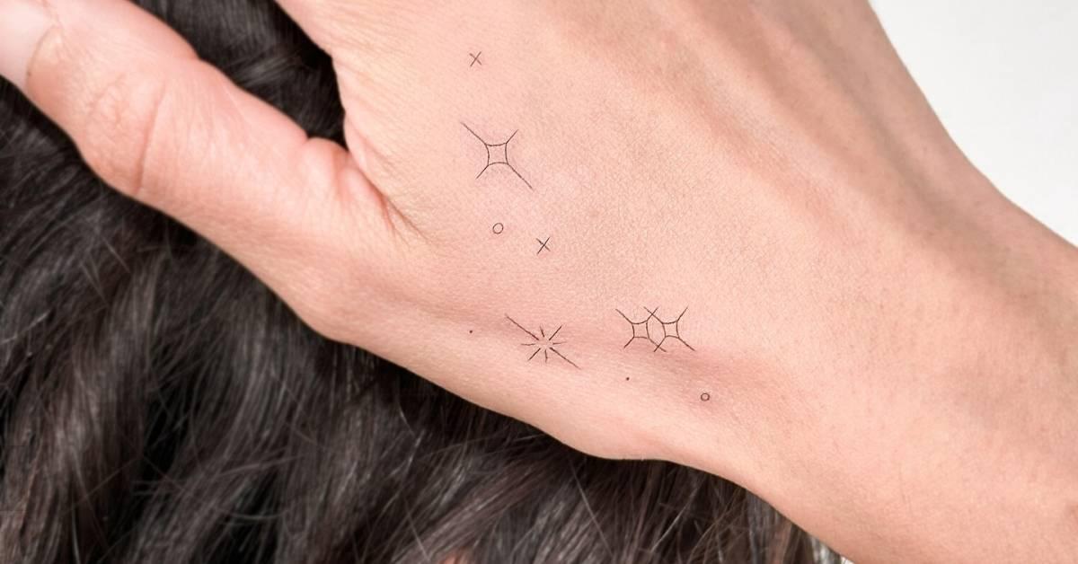 Fine line stars tattoo located on the hand,