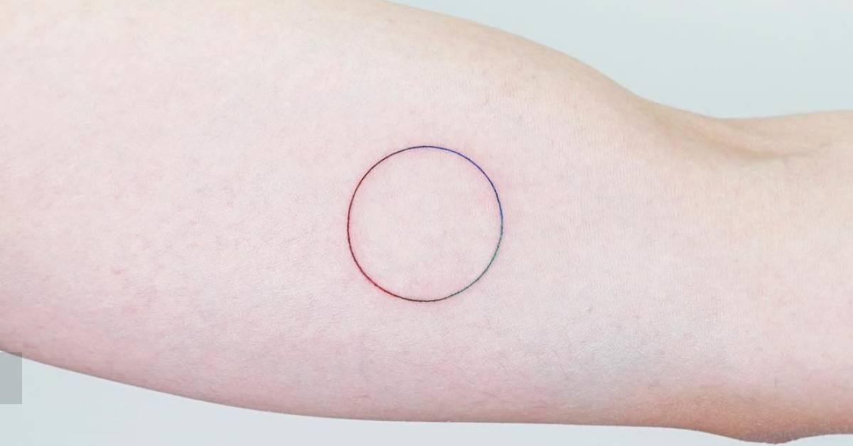 Spectrum circle tattoo located on the inner arm.