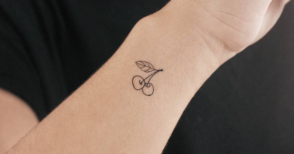 Little fine line cherry couple temporary tattoo located