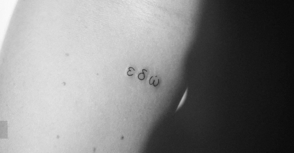 Minimalistic style Greek letters tattoo placed on the