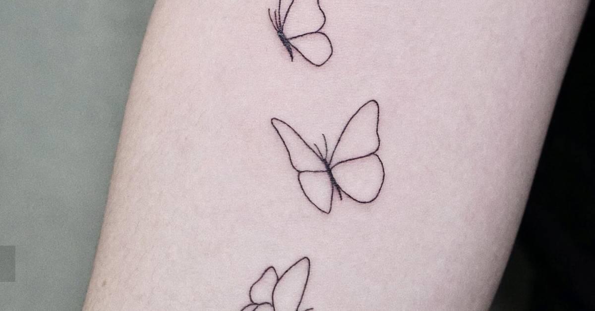 Fine line style minimalistic butterflies tattoo done on