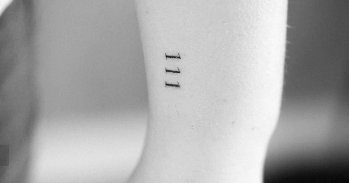 Tattoo of the angel number "111" located on the wrist.