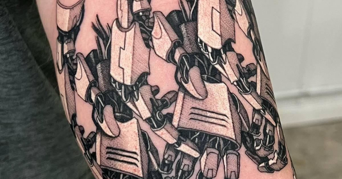 Comic style robot hands tattoo located on the inner
