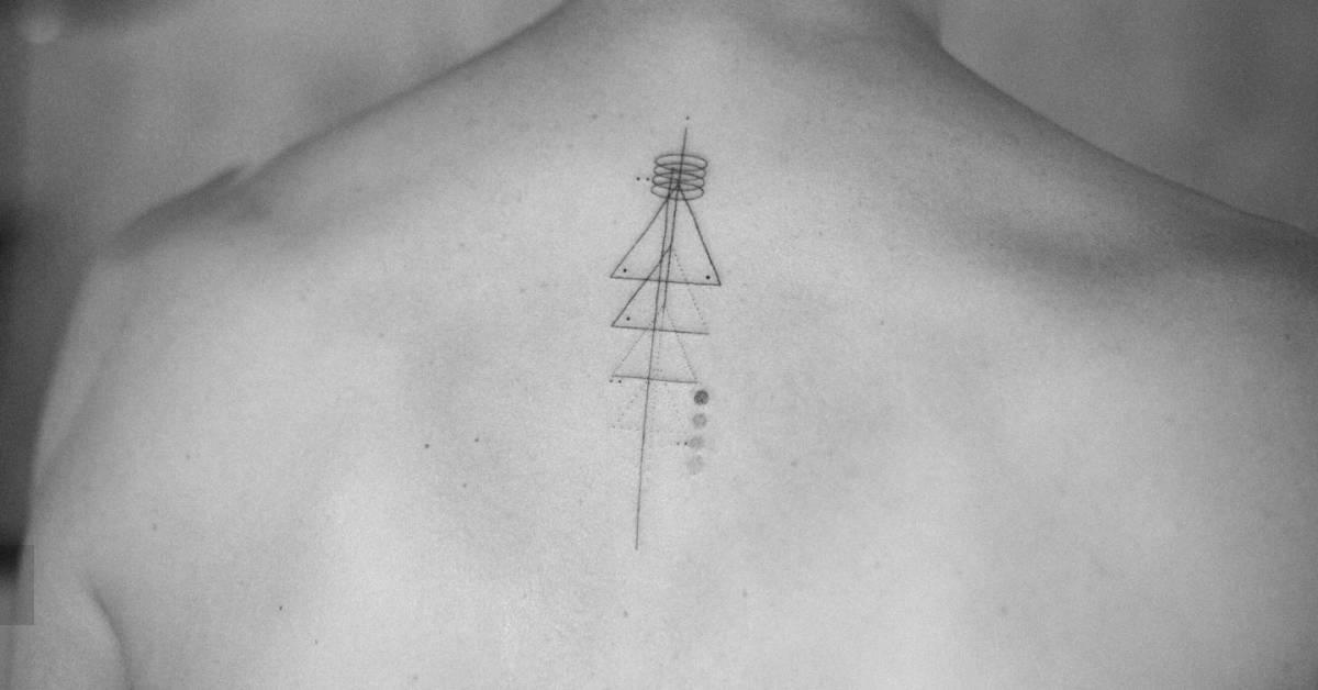 Geometric style triangles tattoo located on the upper