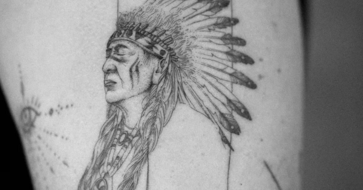 Native american chief tattoo located on the upper arm.