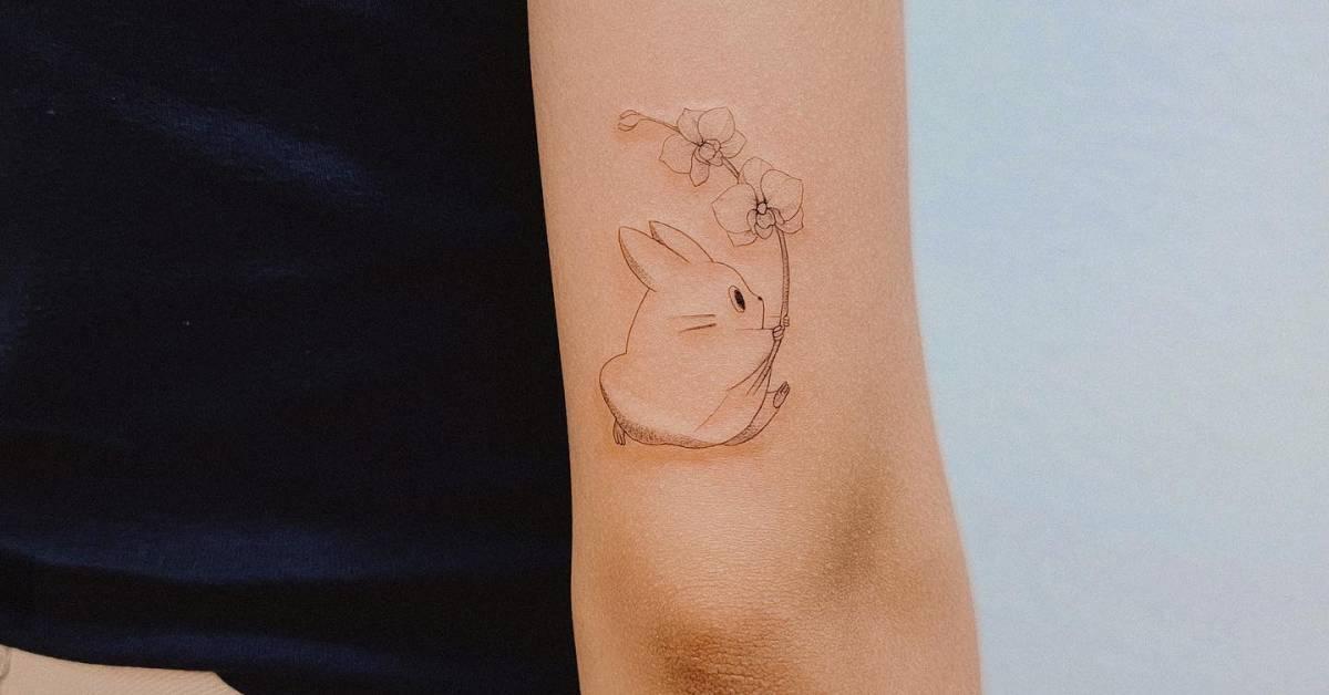 Fine line style Chuu Totoro tattoo located on the